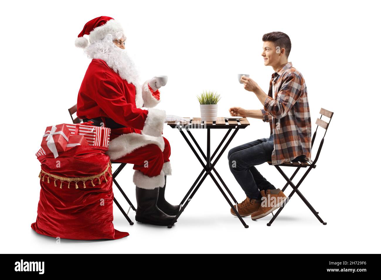 Santa Claus drinking espresso coffee with a young man isolated on white ...