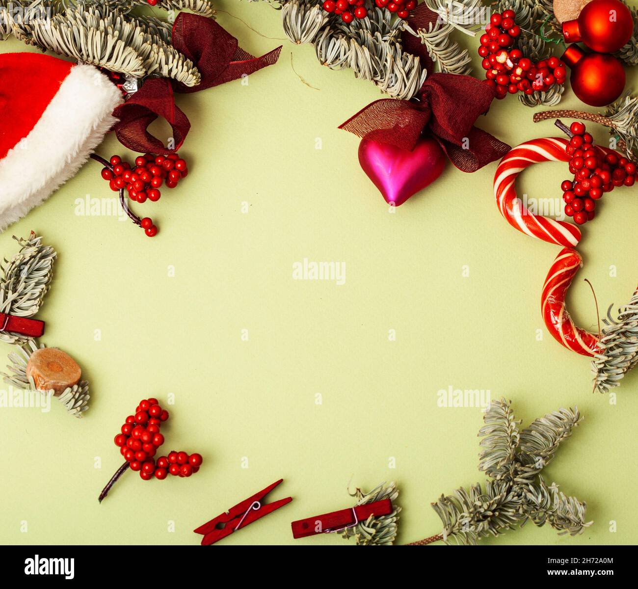 christmass stuff laying flat on colorful background, branch of tree ...