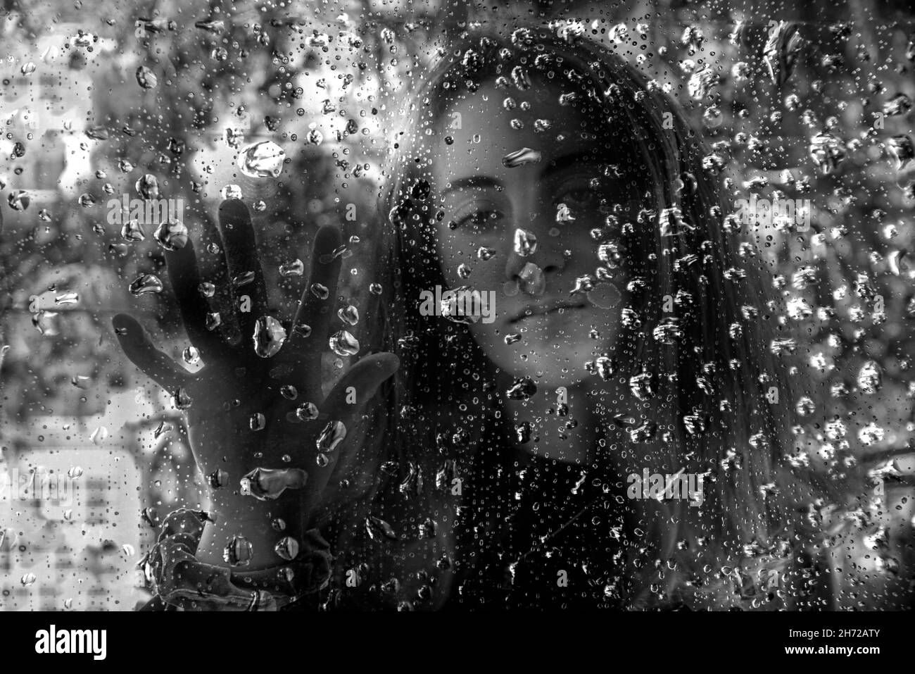 Silhouette of woman behind glass hi-res stock photography and images ...