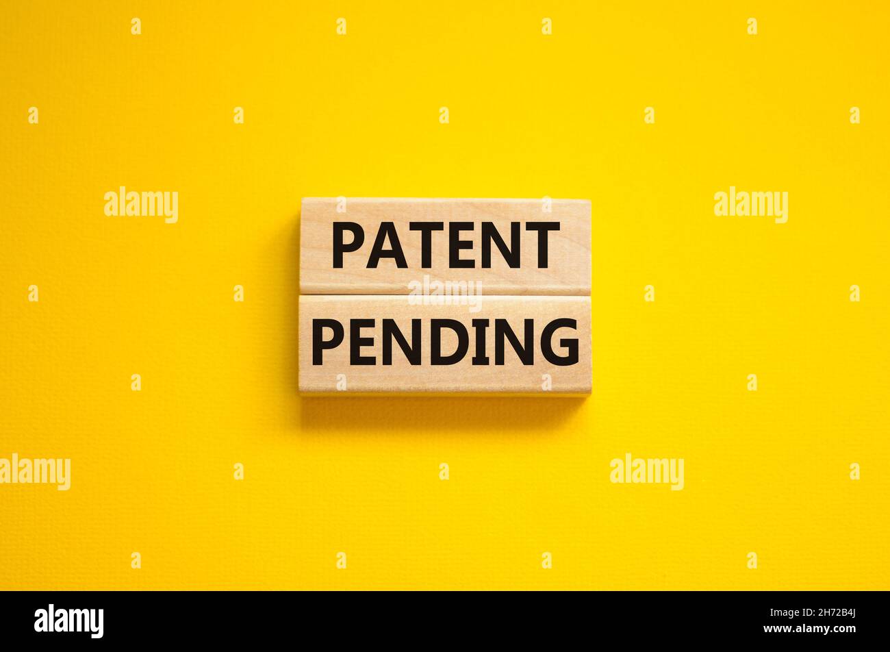 Time to patent pending symbol. Concept words Patent pending on wooden ...