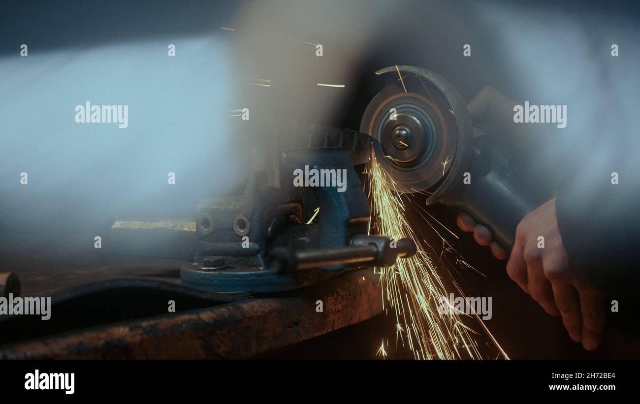 Iron or steel cutting machine close-up, importance of wearing safety ...