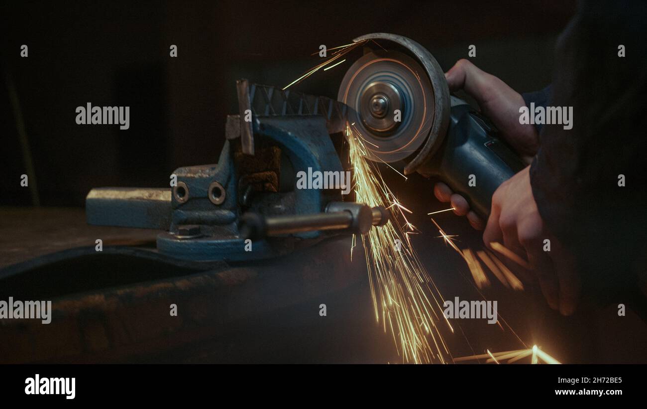 Iron or steel cutting machine close-up, importance of wearing safety ...