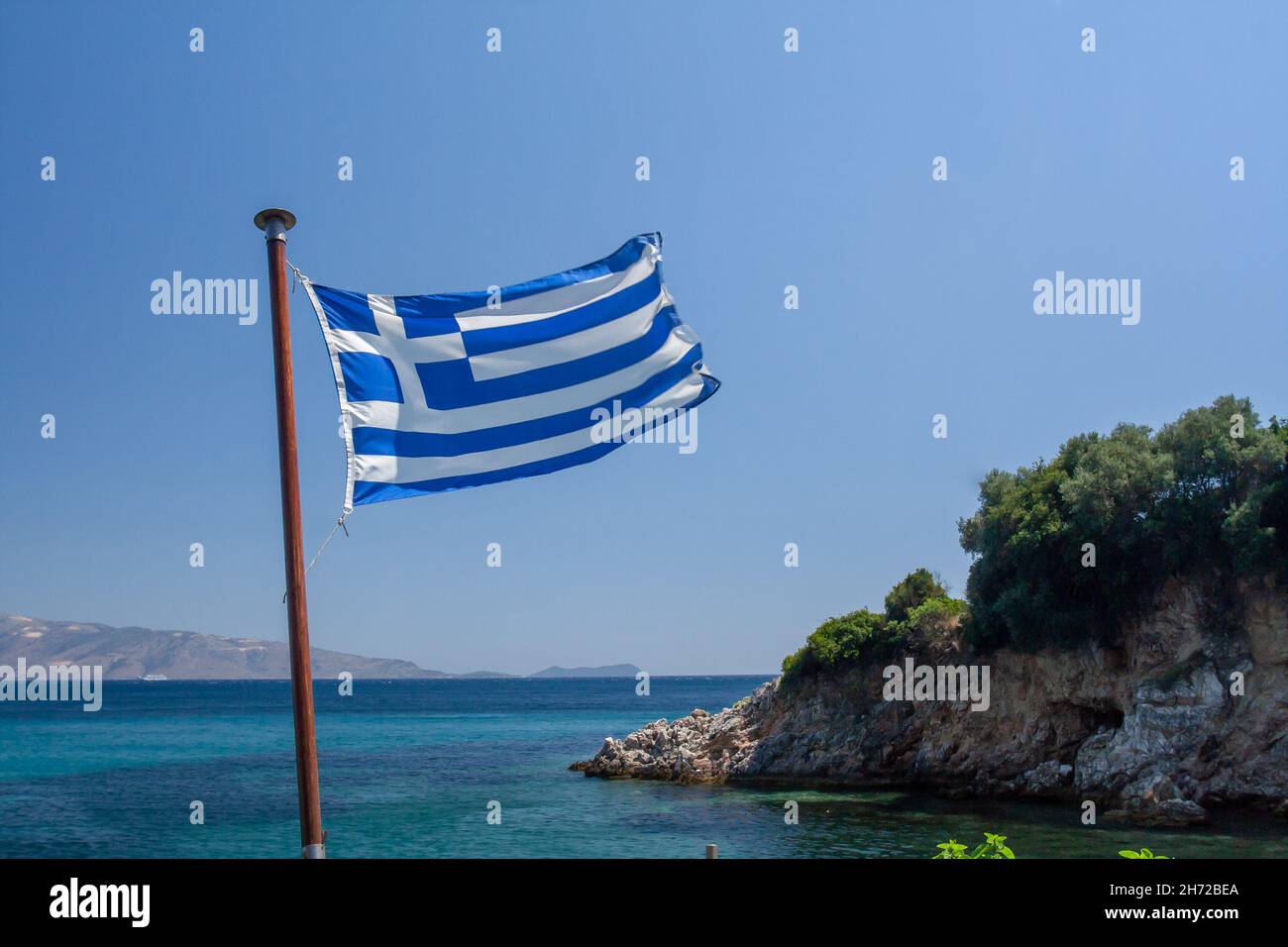 Greek flag waving on a boat with the sea in the background Stock Photo ...