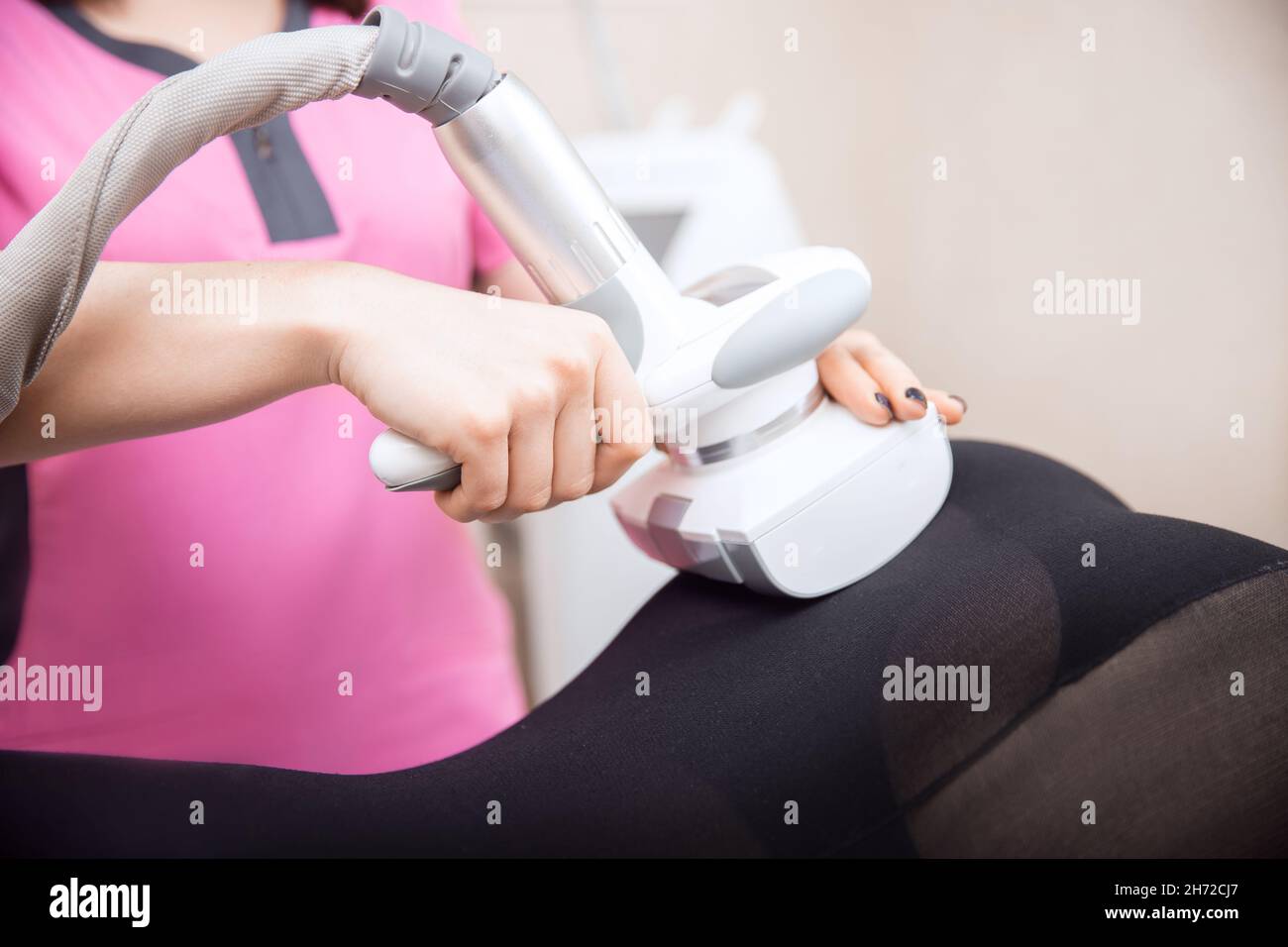 LPG machine massage procedure on legs for lifting body. Woman getting ...