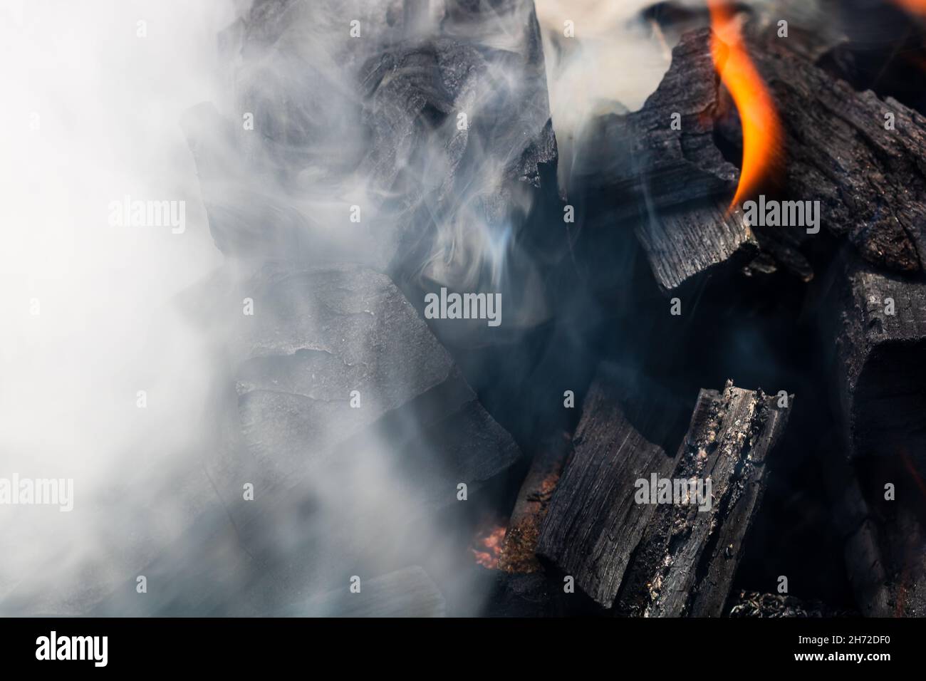 Barbecue grill pit with glowing and flaming hot open fire with red ...