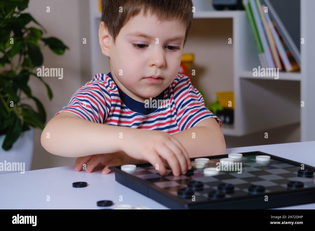 Boy board game hi-res stock photography and images - Alamy