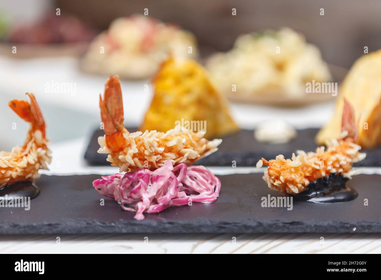 Close up on spanish food tapas on a restaurant table top, no people are ...