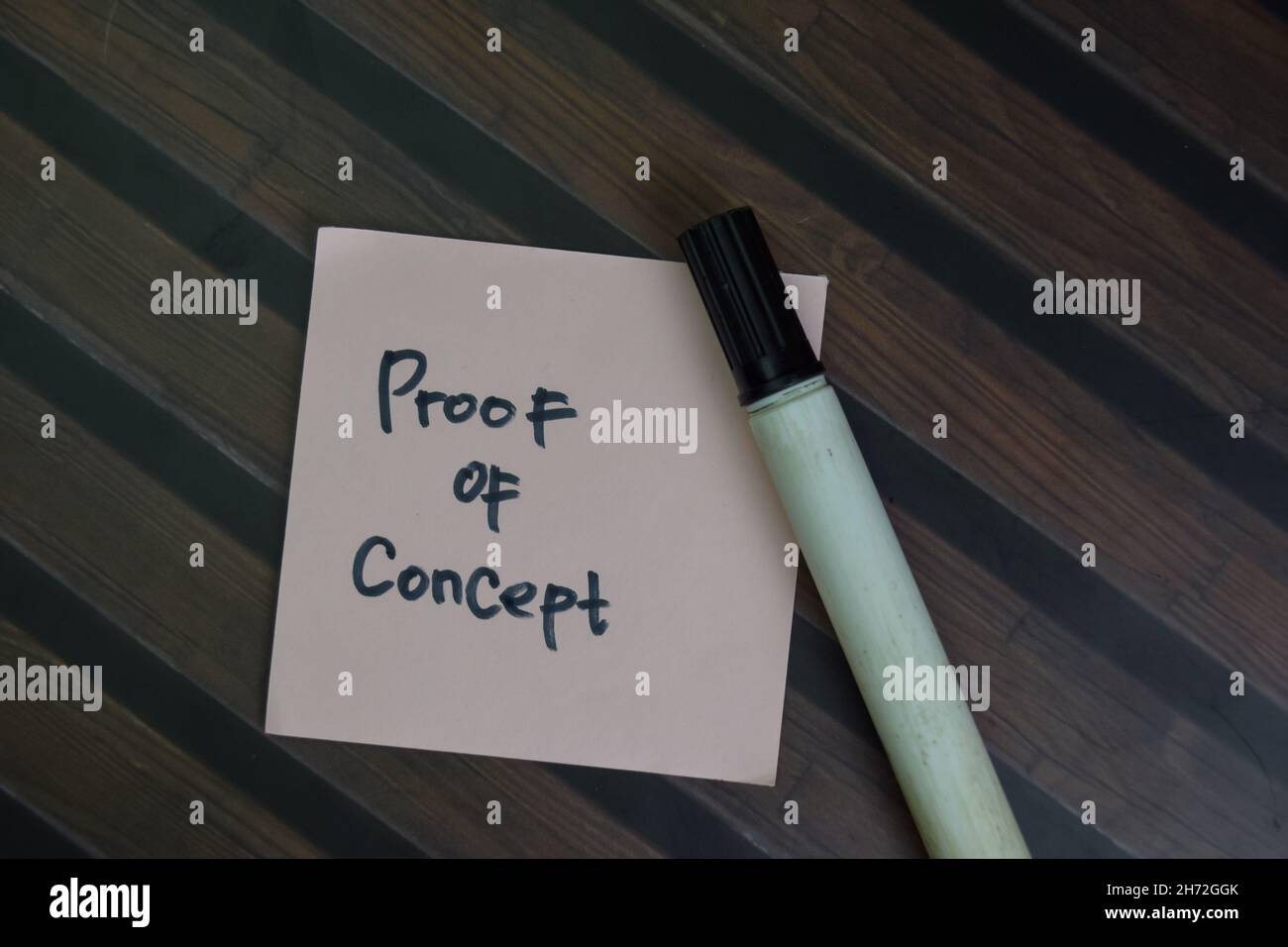 Proof of Concept write on sticky notes isolated on Wooden Table Stock ...