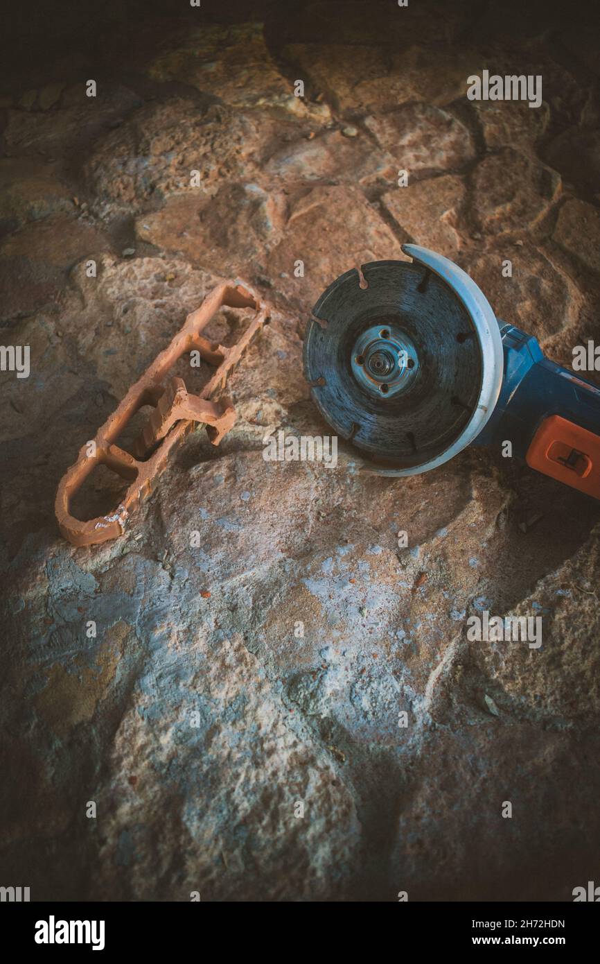 Radial next to pieces of ceramic/tile on a rocky surface Stock Photo ...