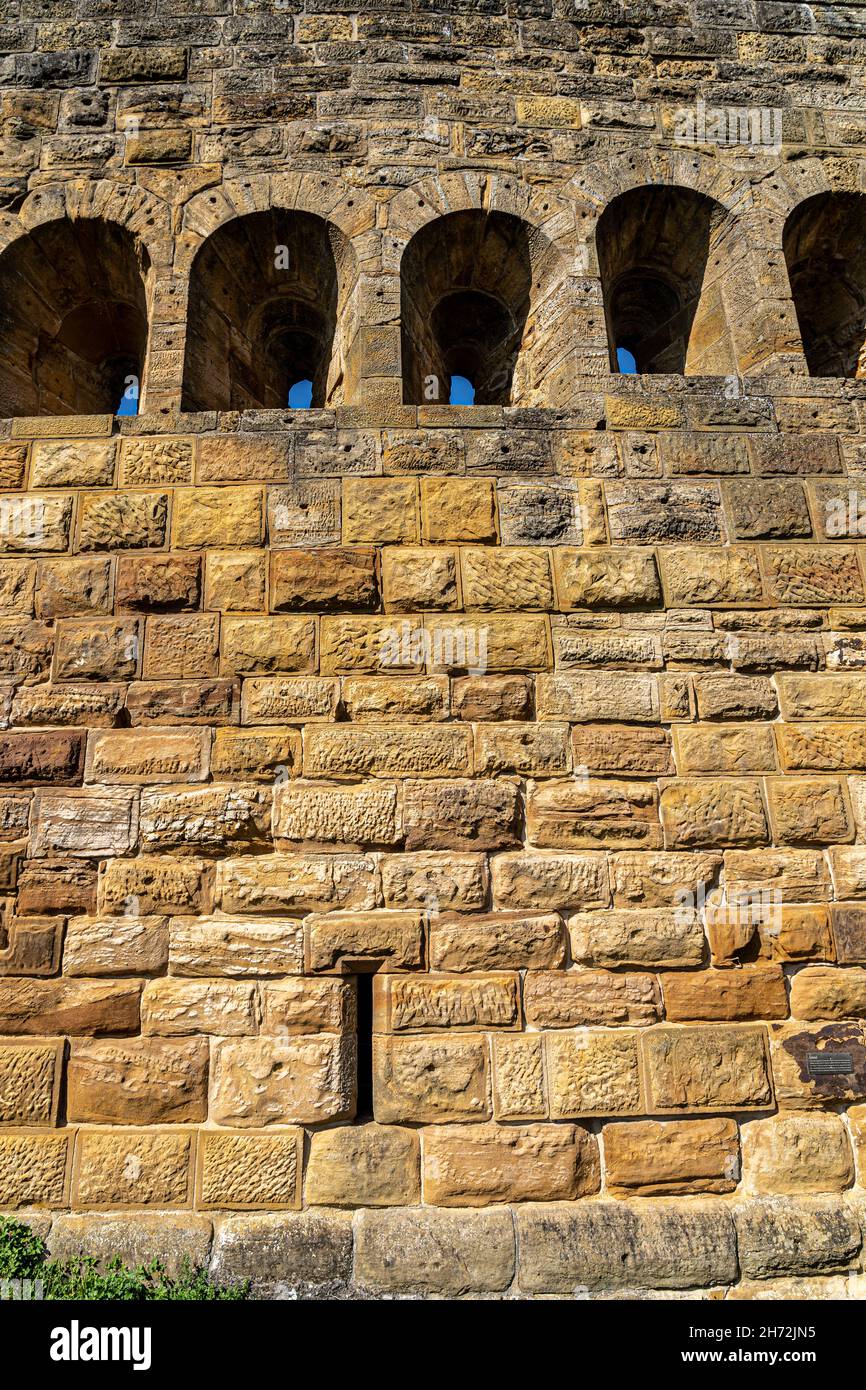 Windows inside of the massive high walls of an old medieval castle ...