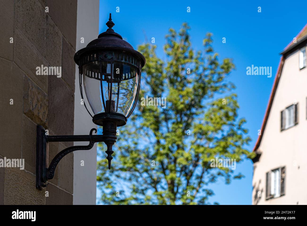 Big lantern on the wall of a historical building Stock Photo - Alamy