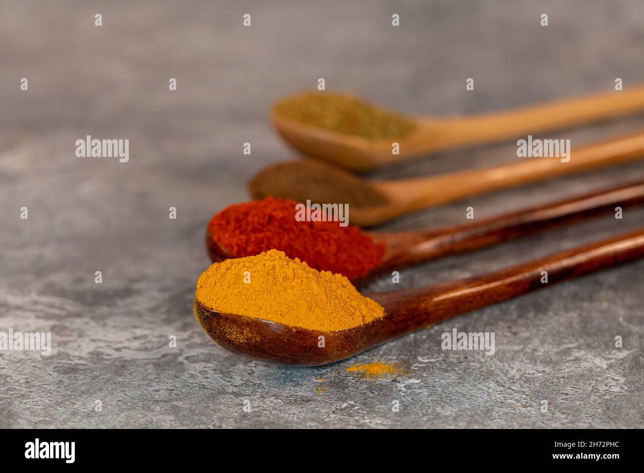 An arrangement of vibrant powdered spices on spoons Stock Photo - Alamy