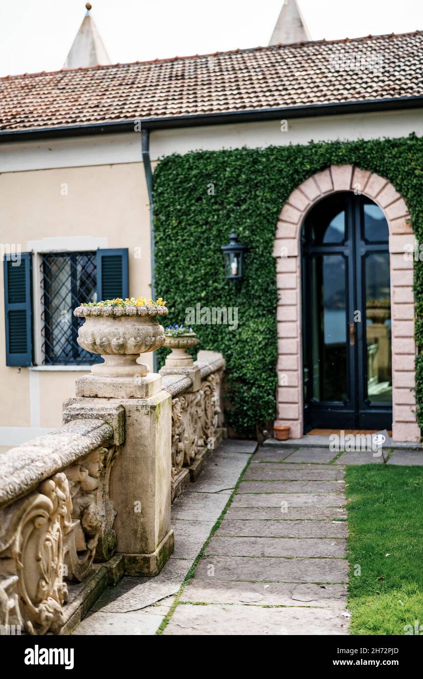 Arched glass door of Villa Balbianello with creeping figs. Italy Stock ...