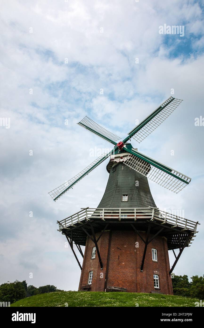 Big windmill nearby the canal and a cloudy sky Stock Photo - Alamy