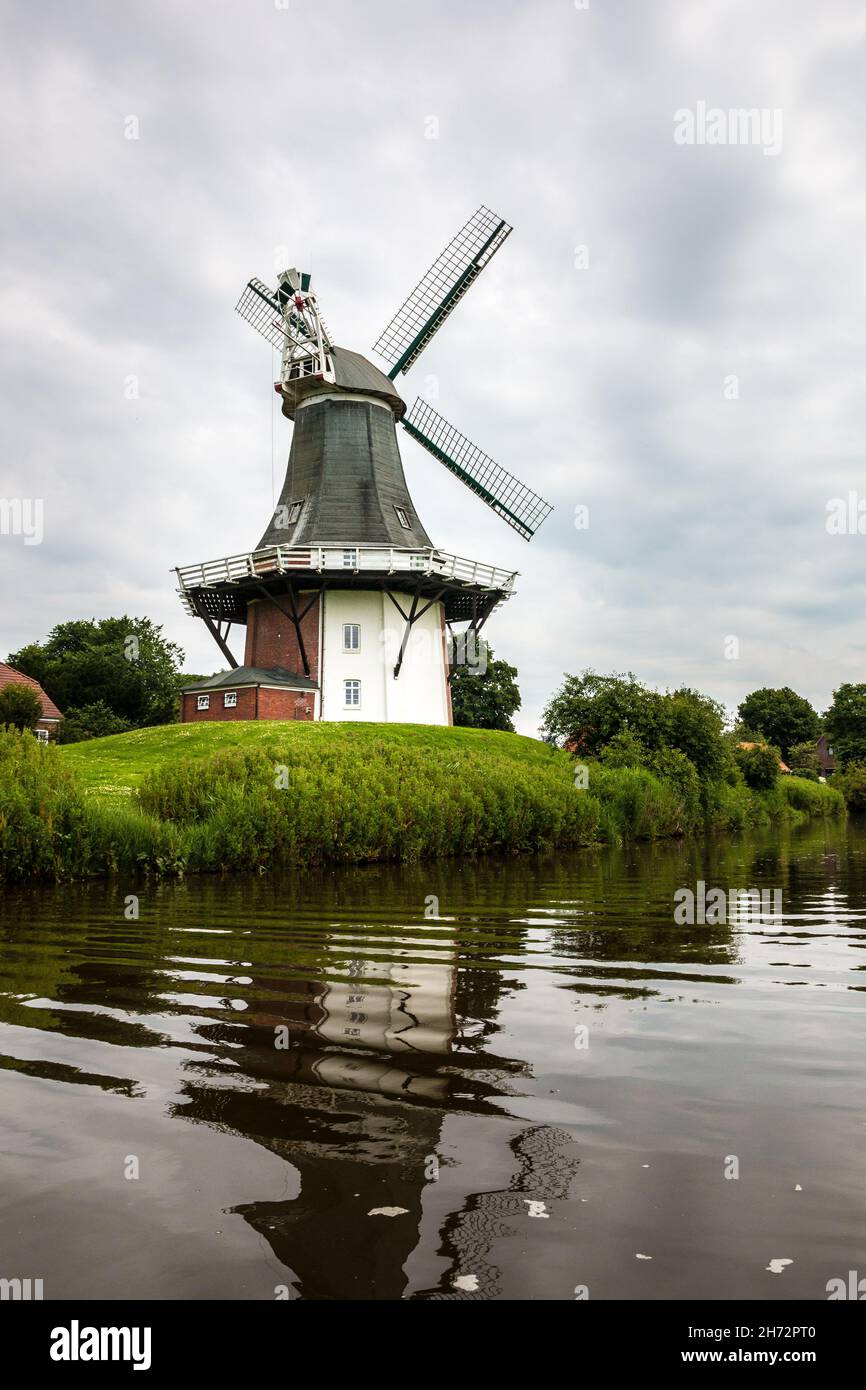 Big windmill nearby the canal and a cloudy sky Stock Photo - Alamy