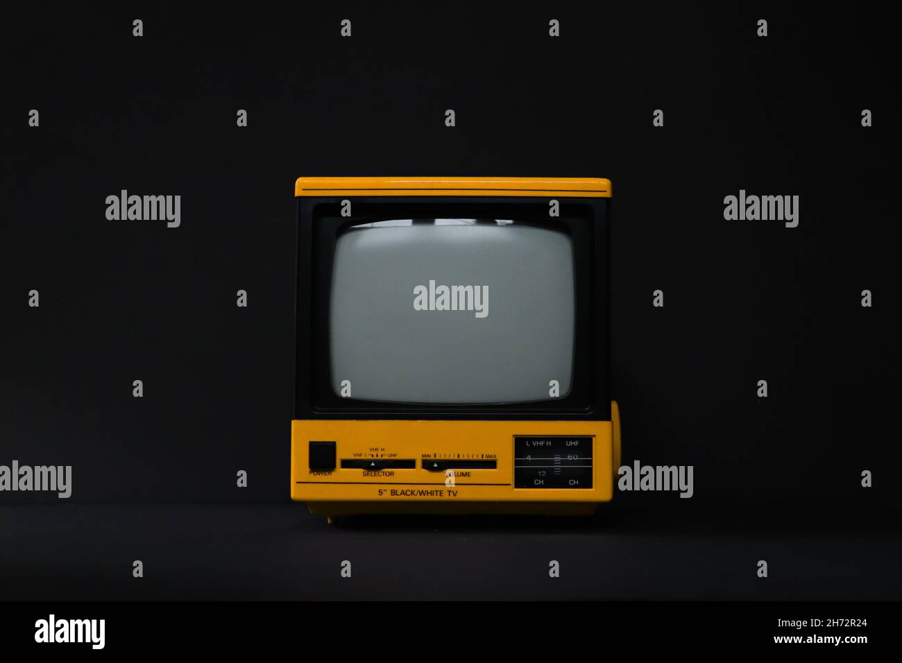Old retro analog television on a black background Stock Photo - Alamy
