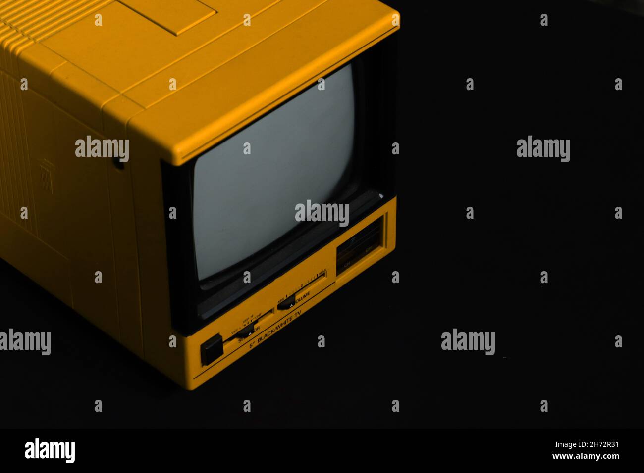 Old retro analog television on a black background Stock Photo - Alamy