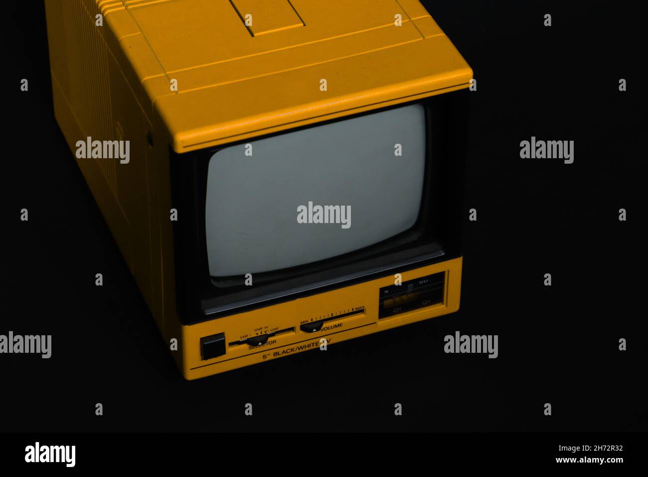 Old retro analog television on a black background Stock Photo - Alamy
