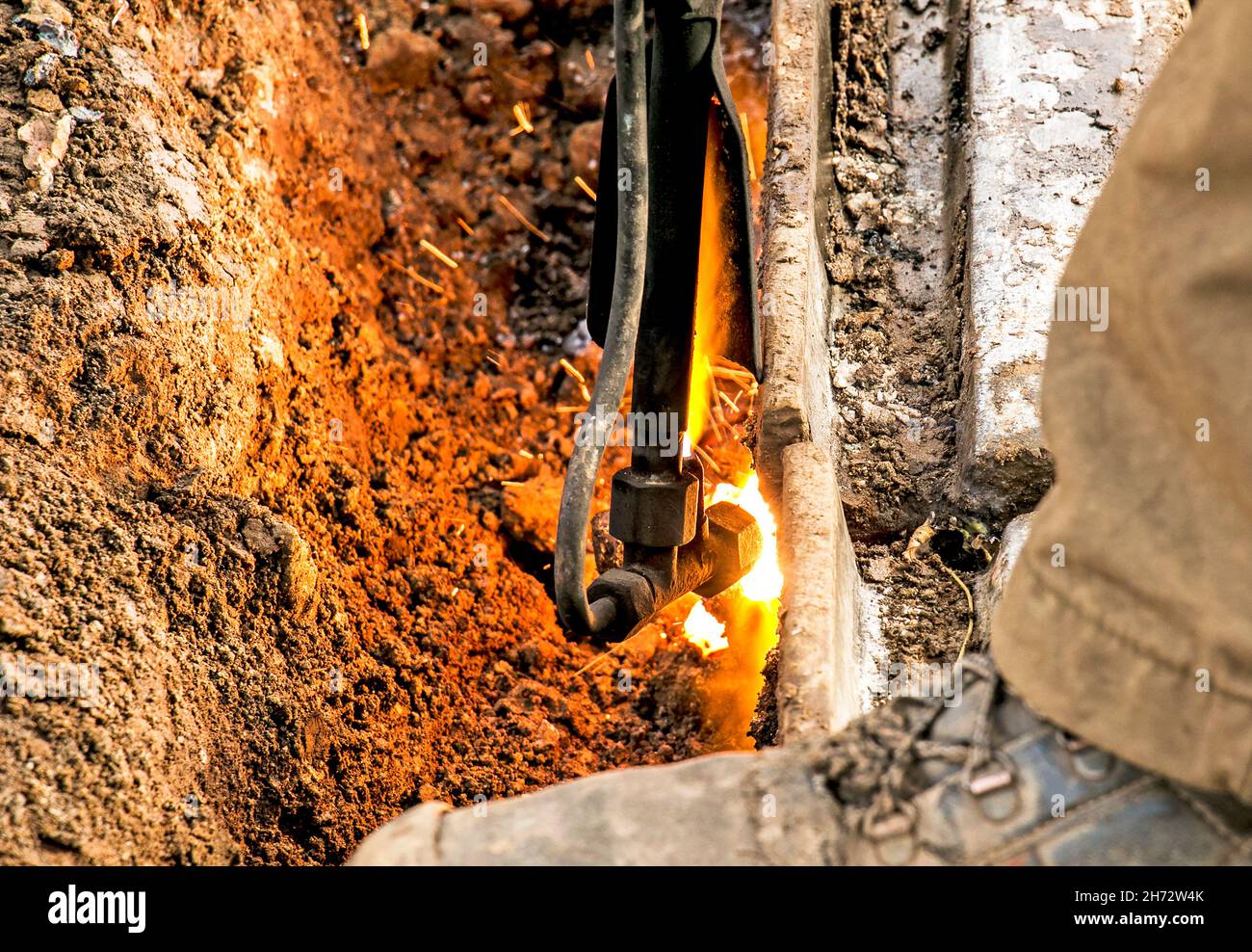 Close-up of the hand of an industrial worker working on the process of ...