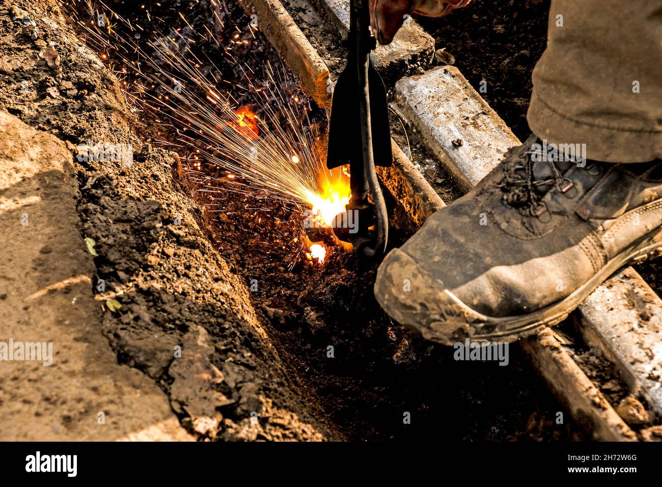 Close-up of the hand of an industrial worker working on the process of ...
