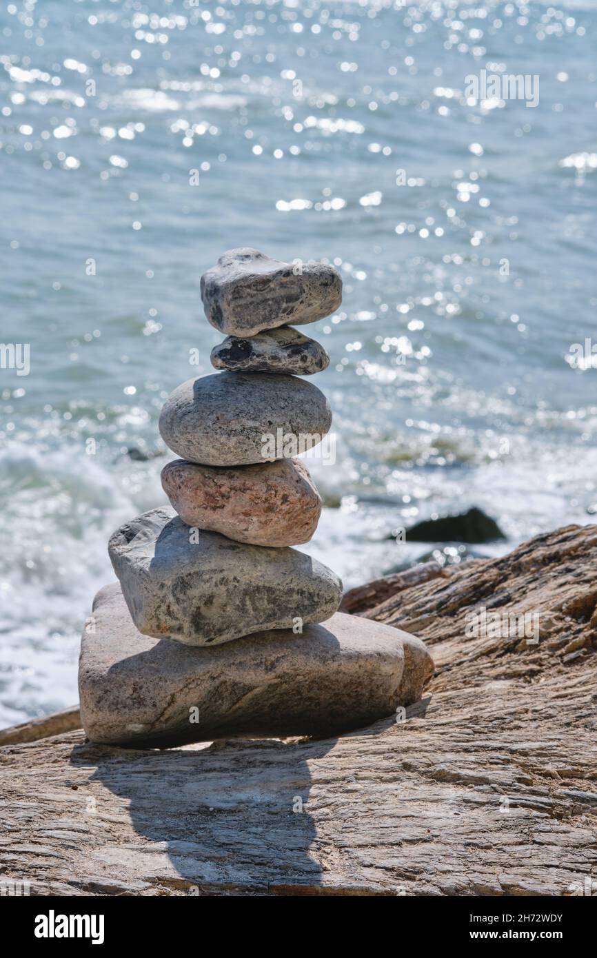 View of stone tower on the beach and sea as background Stock Photo - Alamy