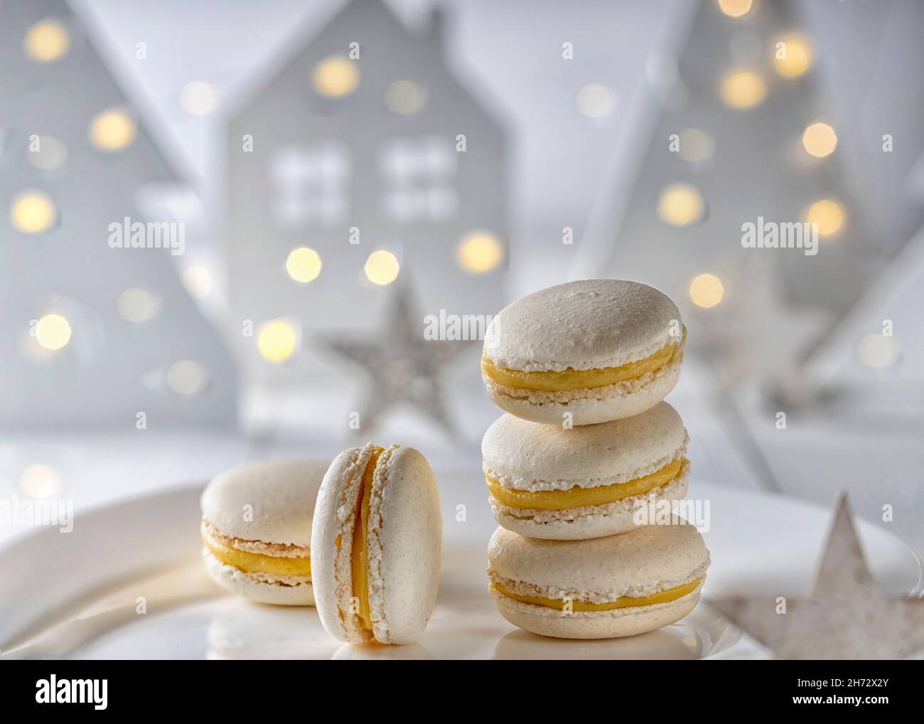 White macaroons with light bulb background Stock Photo - Alamy