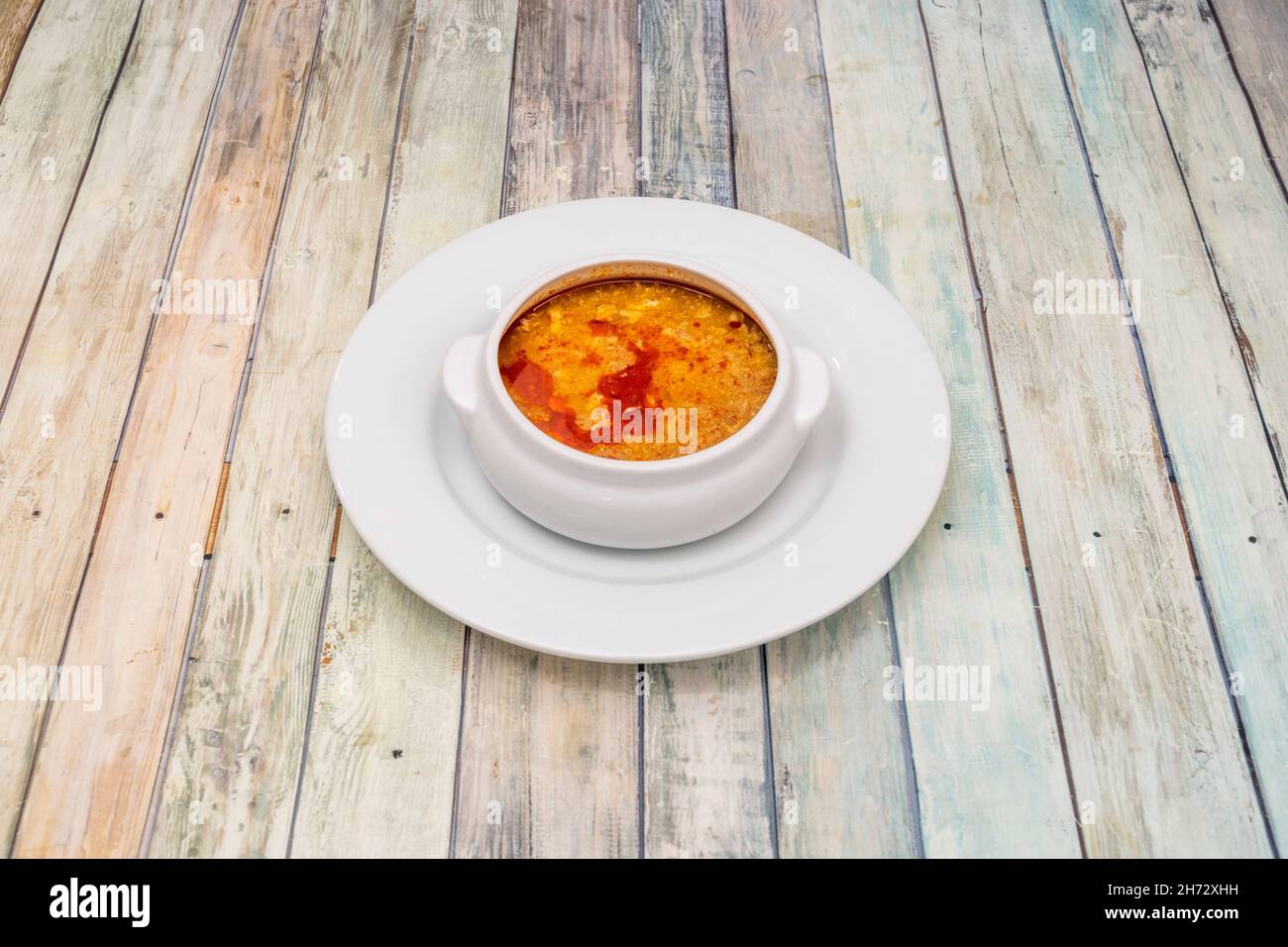 White bowl with Castilian soup, centuries old food recipe Stock Photo ...