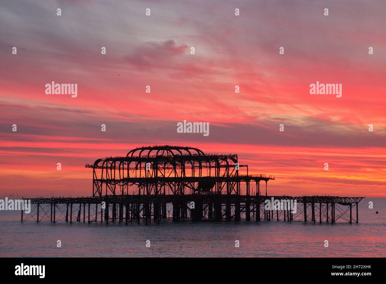 Sunset at West Pier, Brighton Stock Photo - Alamy