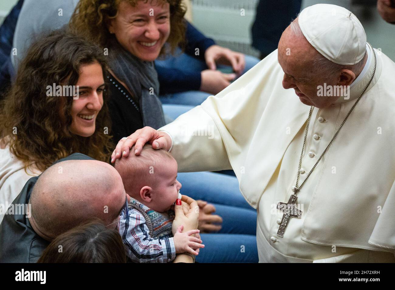 Pope Francis blesses a baby among faithful devotees during his ...