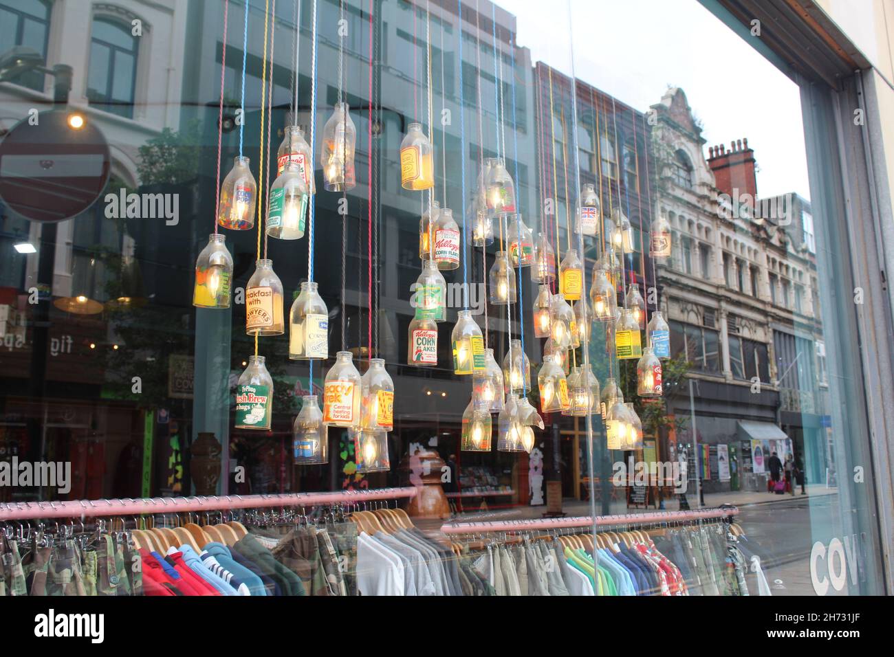 Hanging bottle display in a shop window Manchester, England Stock Photo ...