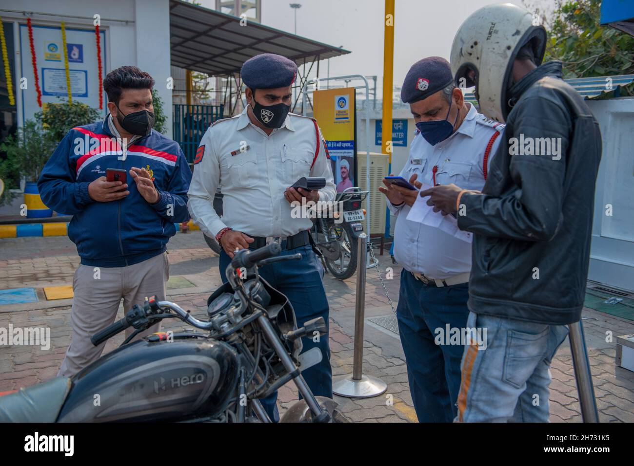 Delhi transport department officials seen checking a motorcycle at a ...