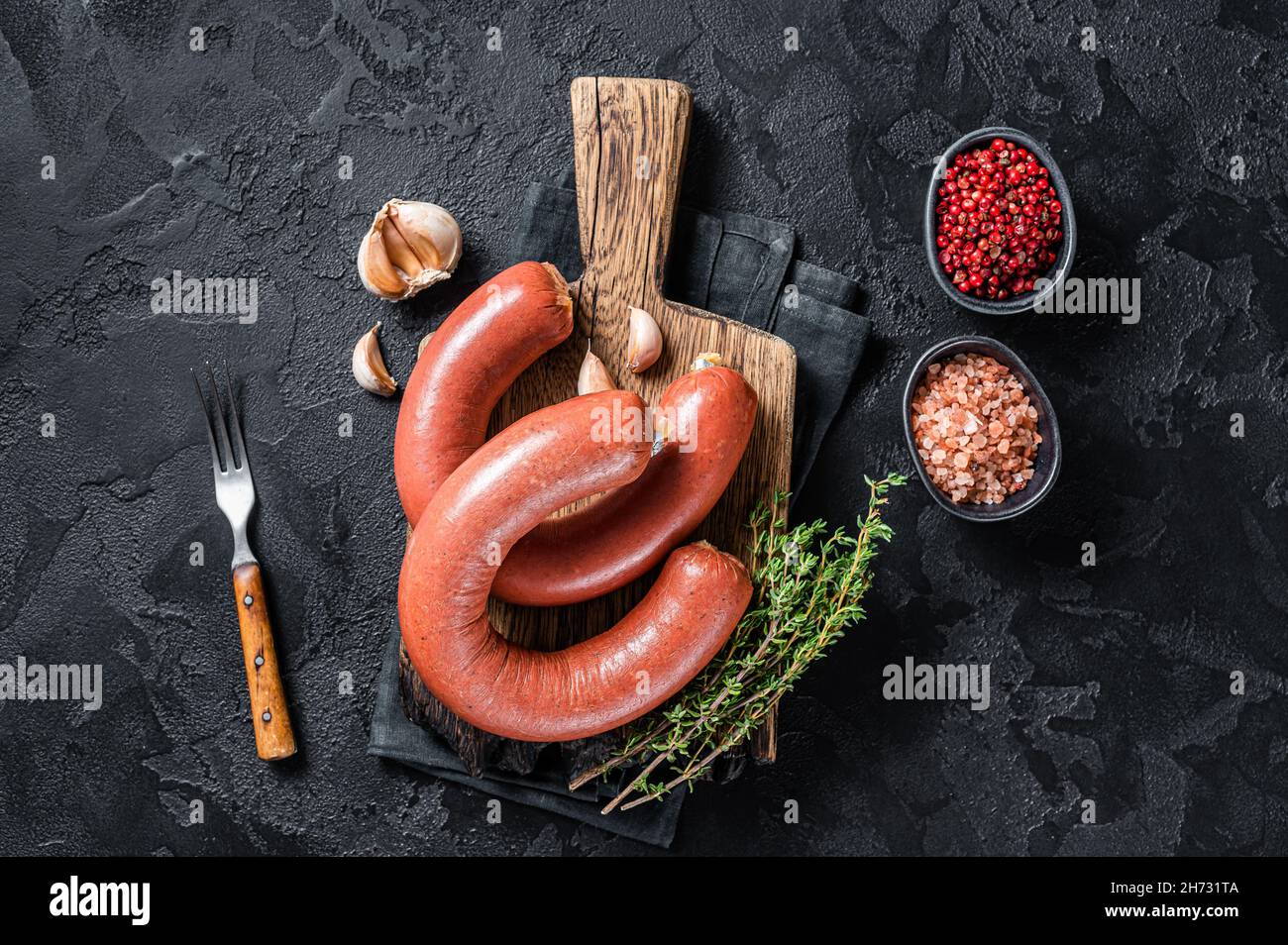 Sucuk meat sausage, Sujuk dry spicy sausage. Black background. Top view ...
