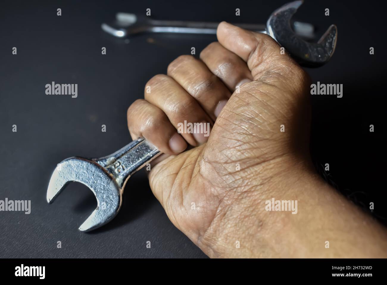Selective focus photo of labor or Worker or man holding industrial ...