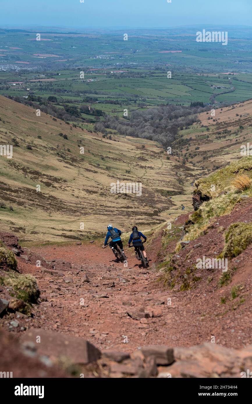 Two men ride mountain bikes in the Brecon Beacons national Park in ...