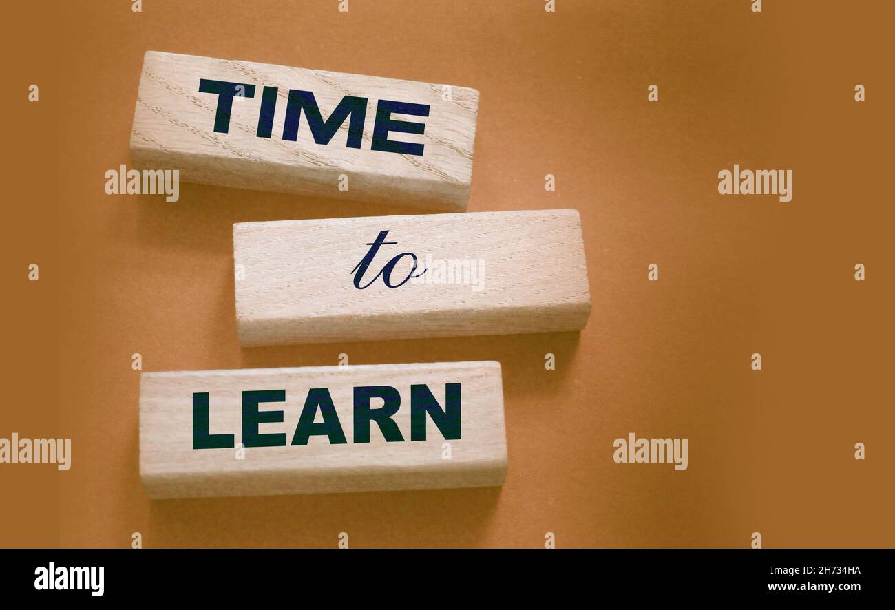 Time to Learn on wooden blocks put black. Education concept. Life-time ...