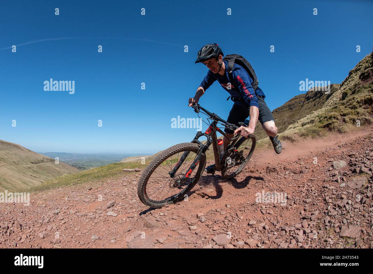Two men ride mountain bikes in the Brecon Beacons national Park in ...