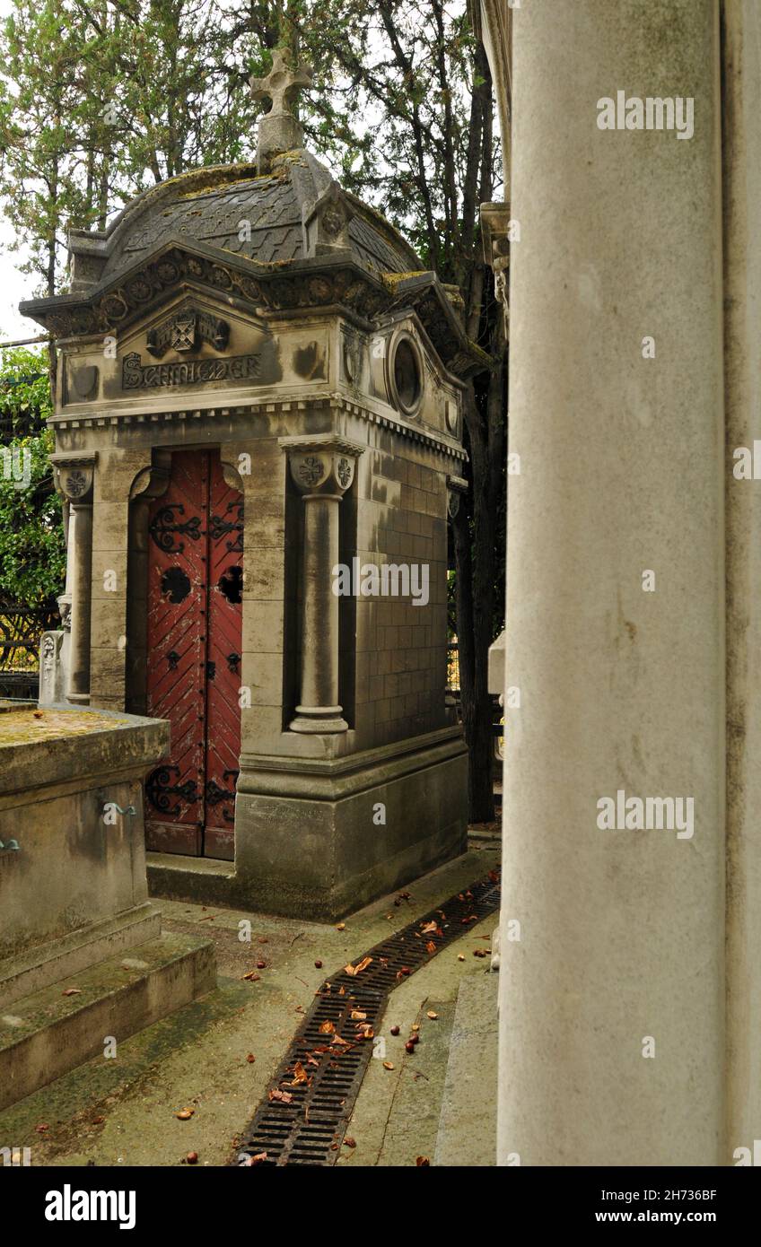 Grand mausoleums line the paths at the historic Passy Cemetery ...