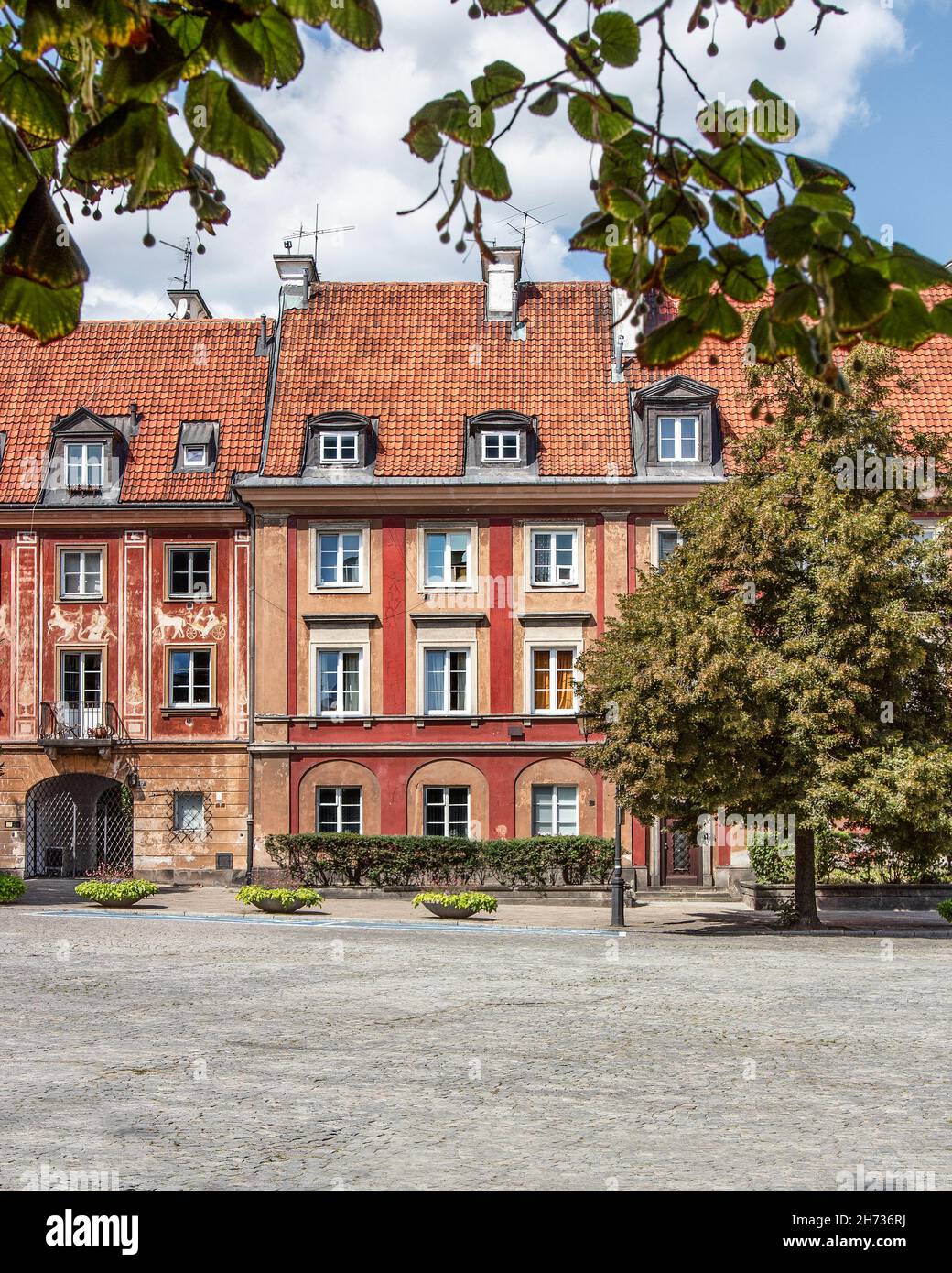 Warsaw Old Town, view on a summer morning of a beautiful red facade in ...