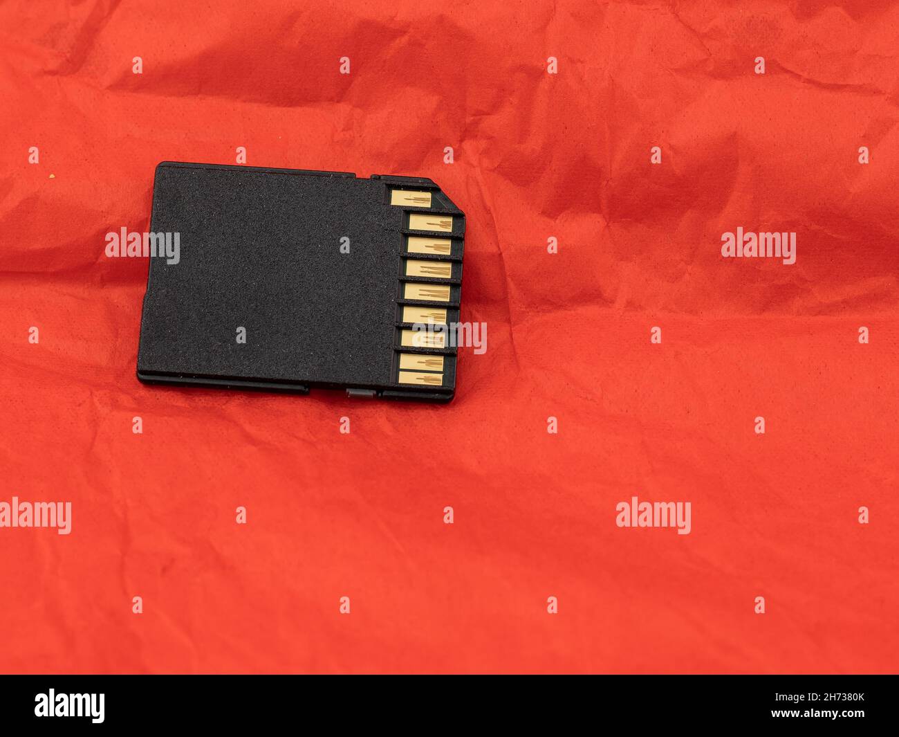 sd memory device on red background Stock Photo - Alamy