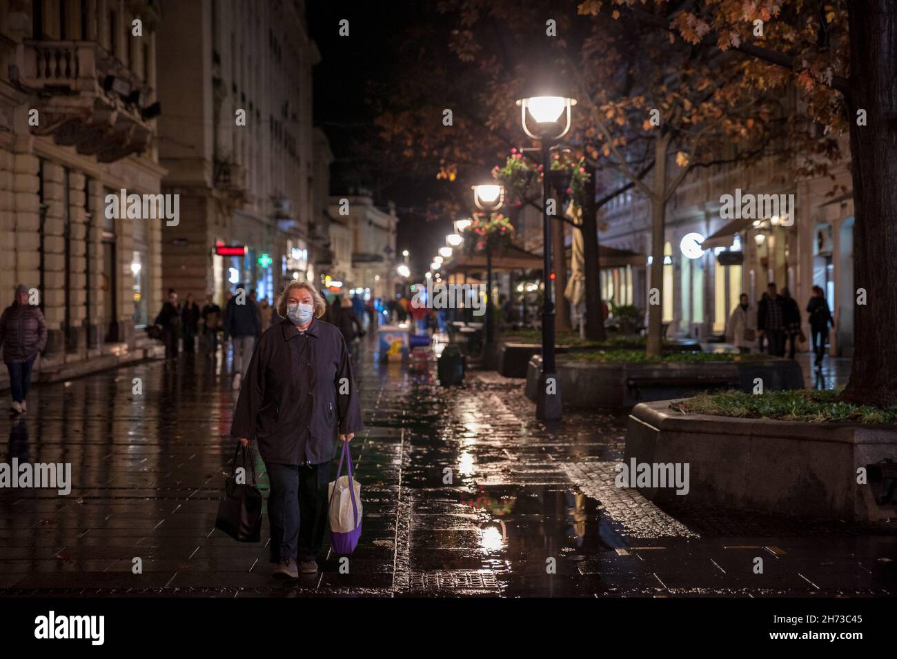 Picture of a white caucasian senior woman in belgrade, serbia, standing in the streets of ...