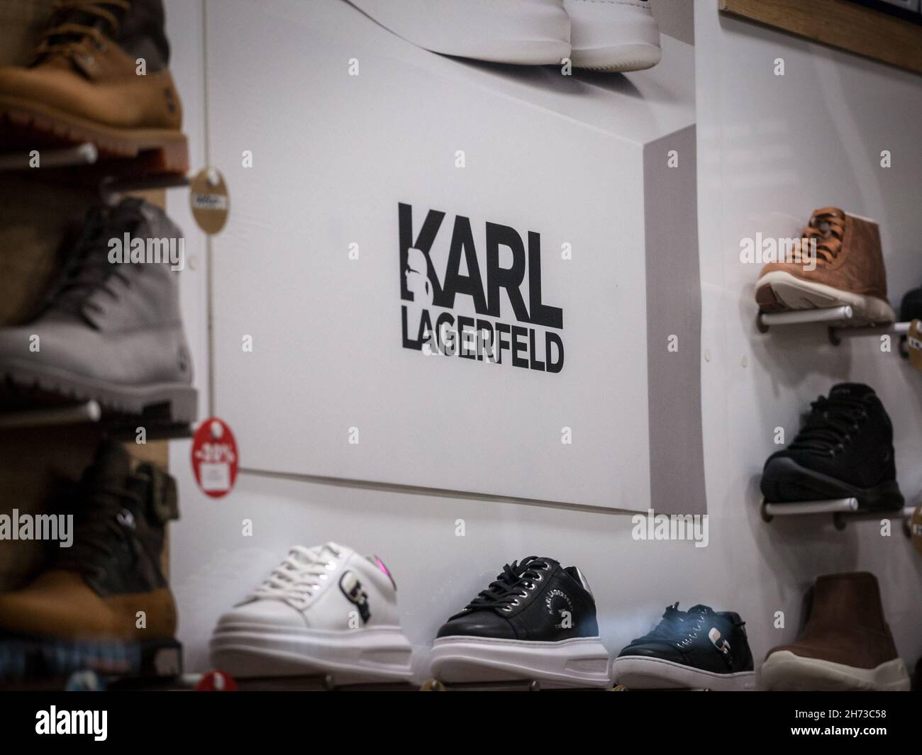 Picture of a sign with the logo of Karl Lagerfeld in front of shoes ...