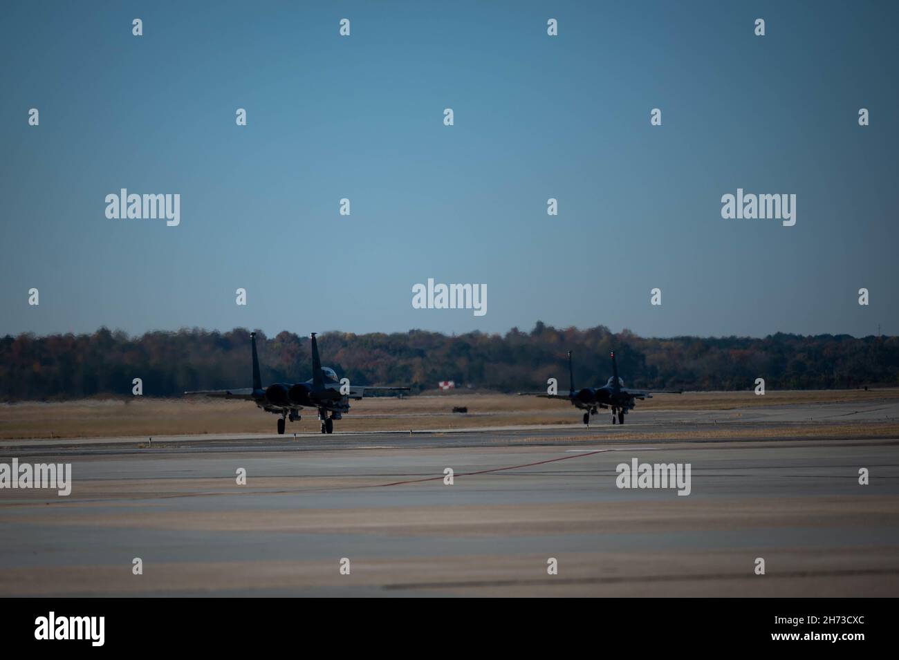 Two F-15E Strike Eagles from the 335th Fighter Generation Squadron taxi ...