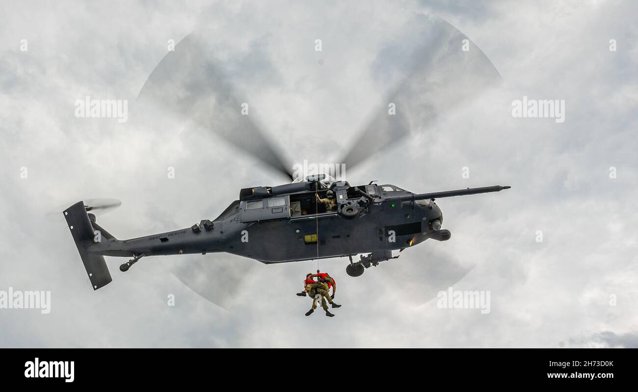 31st Rescue Squadron pararescuemen conduct hoist operations aboard the ...