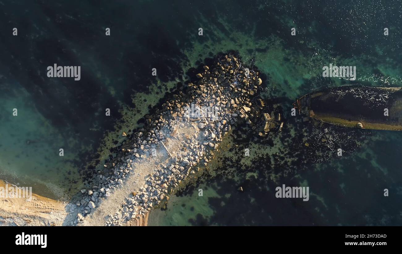 Aerial view of the ship washed ashore. Shot. Top view of an abandoned ...
