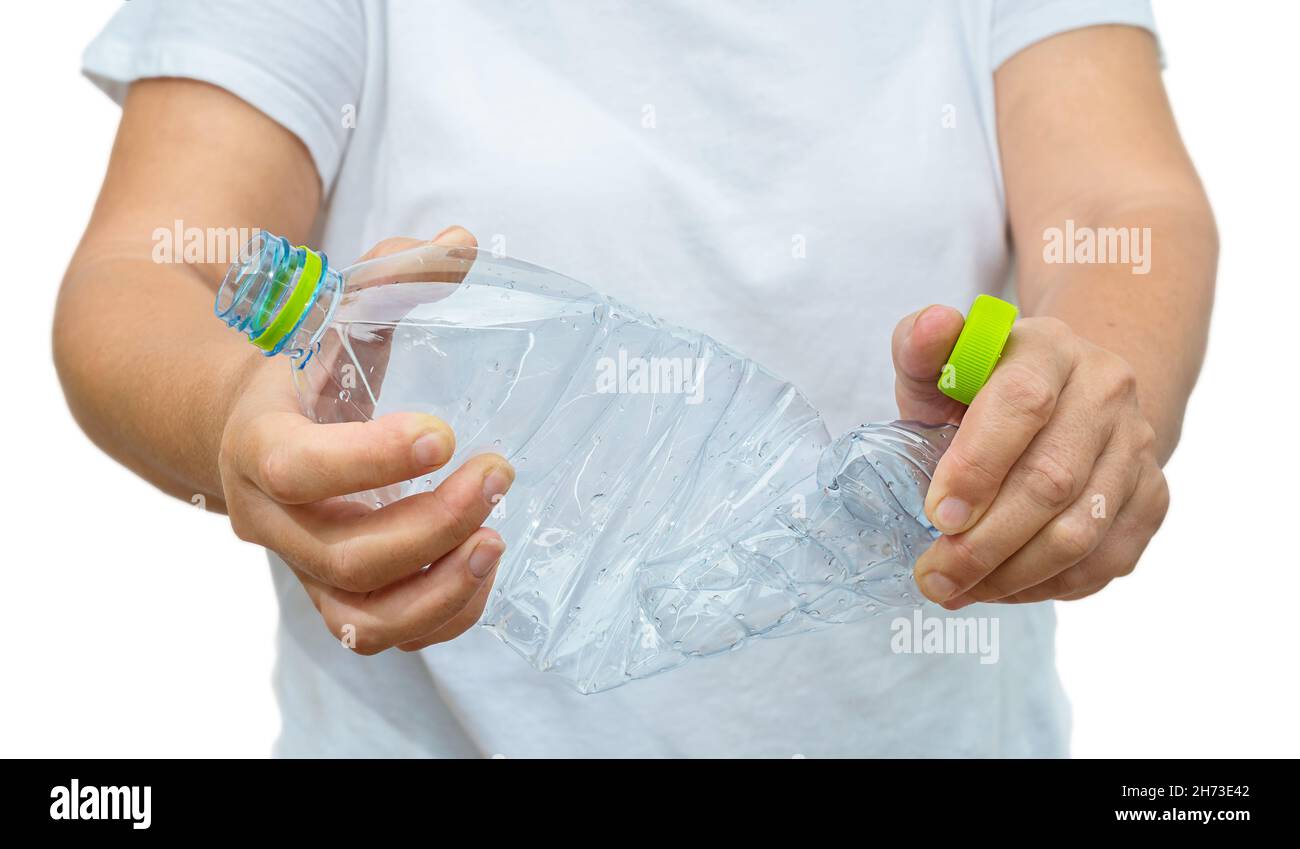 Female hands twist plastic bottle isolated on white background Stock ...