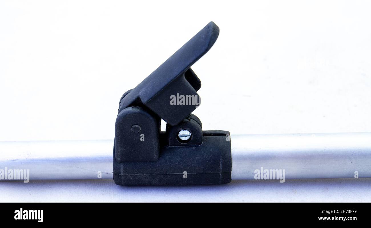 A pole adjuster fitted on a metal pole isolated on a clear background ...