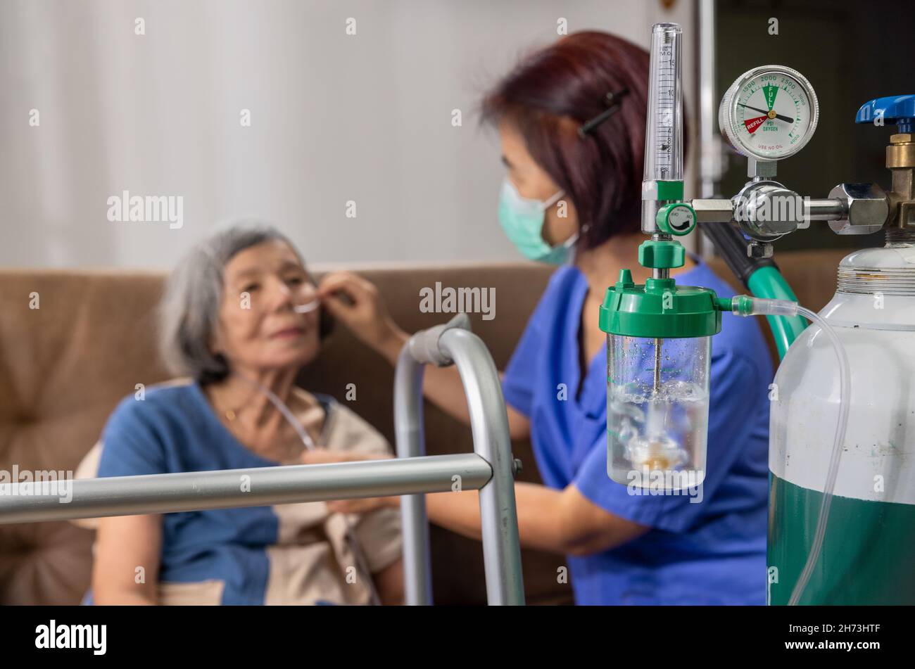 Elderly woman wearing oxygen nasal cannula at home Stock Photo - Alamy