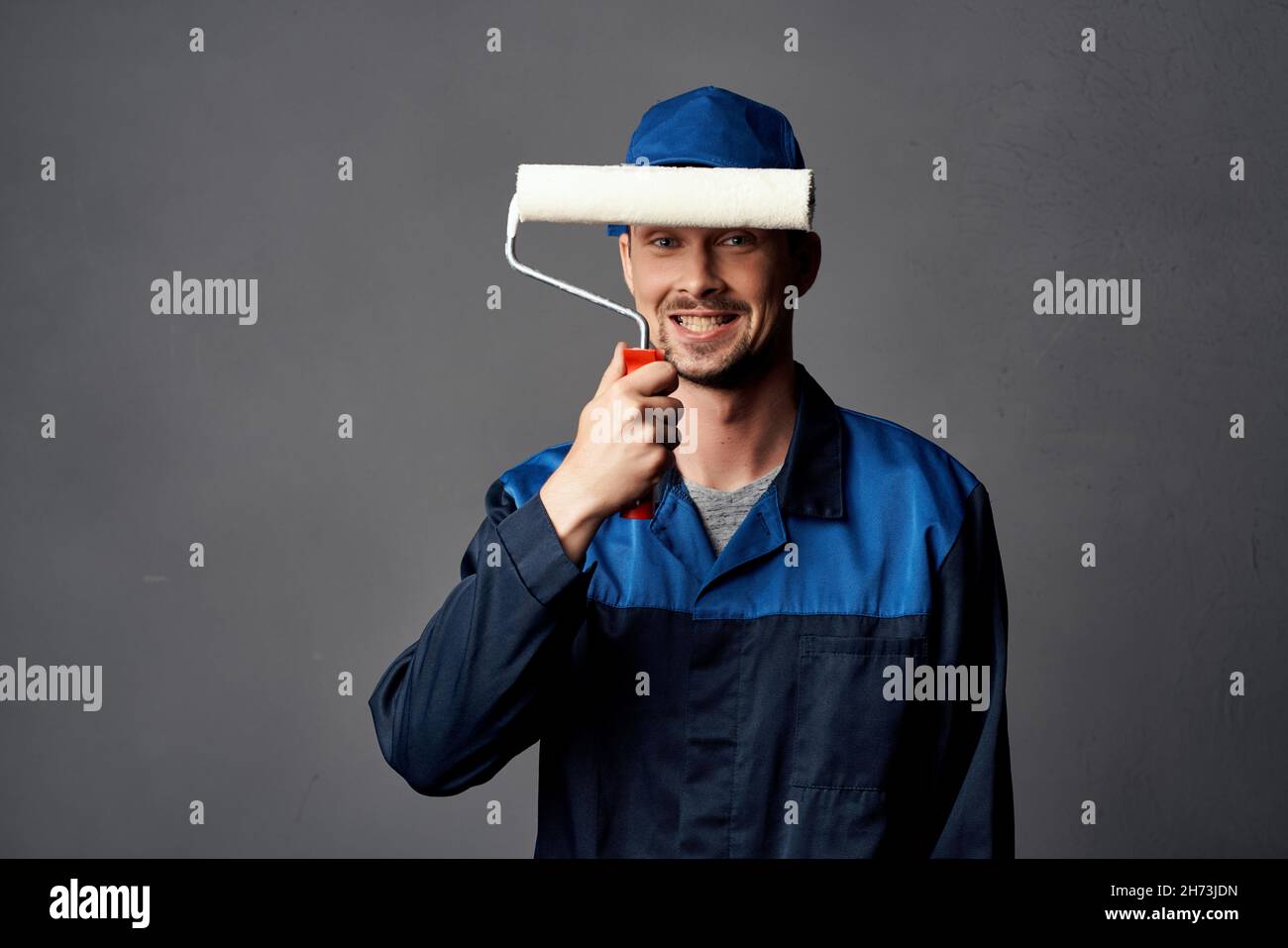 worker painter in construction form emotions studio posing Stock Photo ...