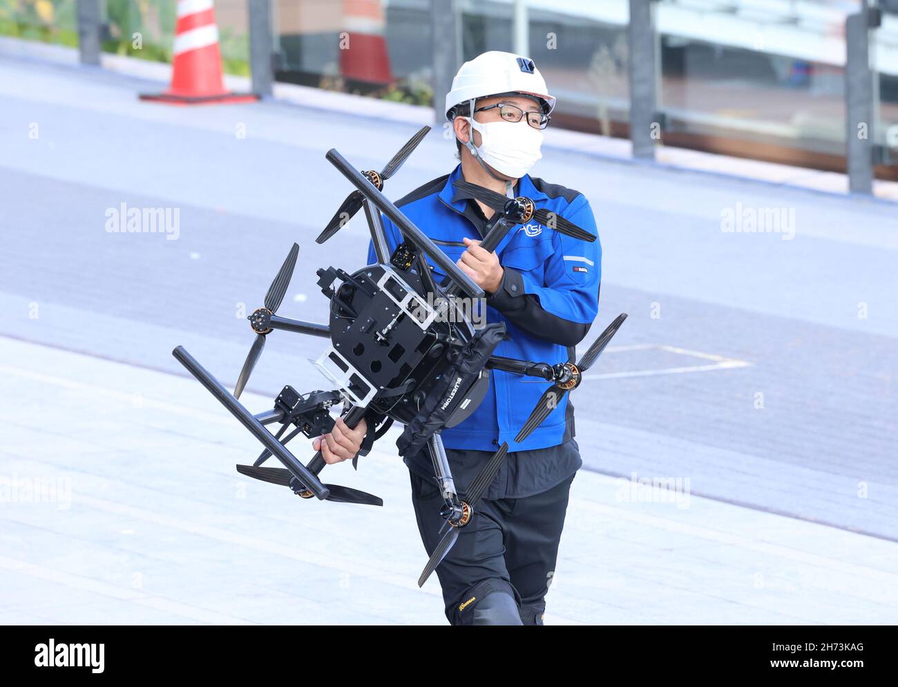 Tokyo, Japan. 20th Nov, 2021. Japan's drone maker ACSL engineer holds ...
