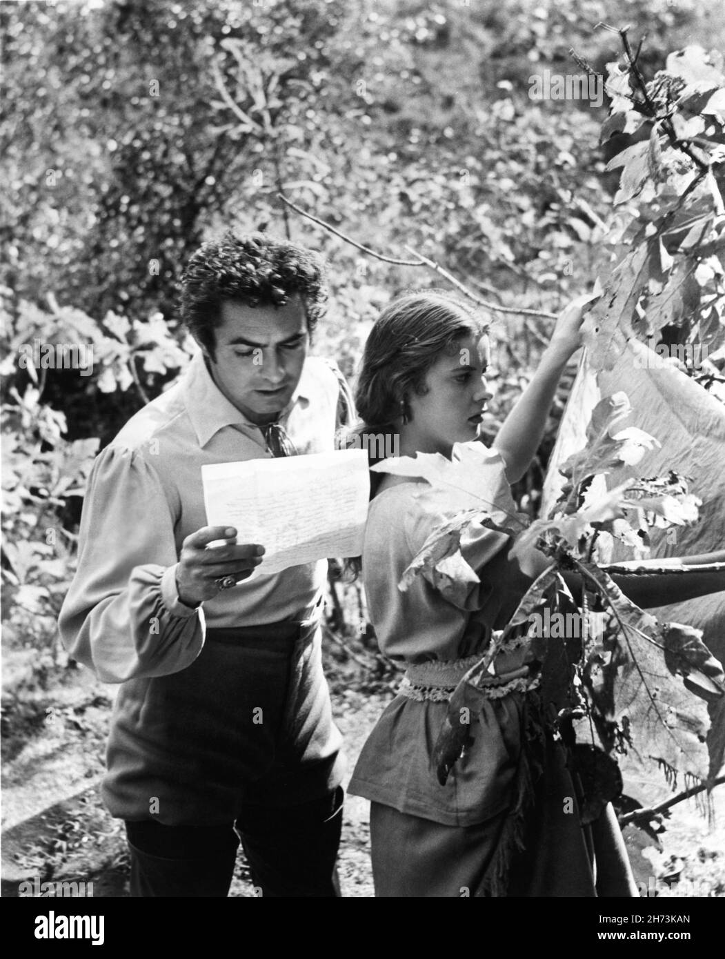 TYRONE POWER and JEAN PETERS on set location candid during filming of ...
